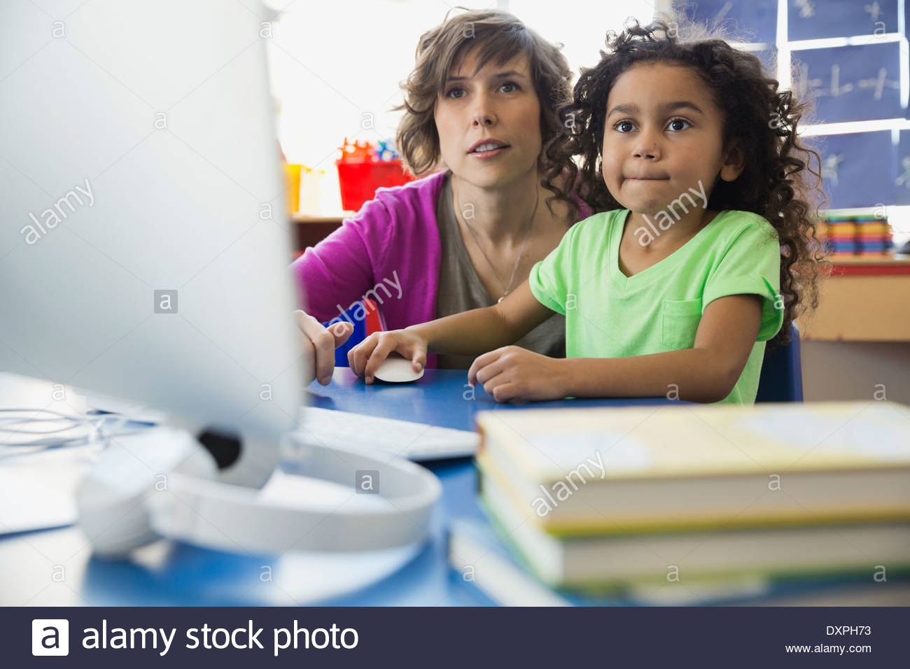 Teacher using computer school hi-res stock photography and images - Alamy