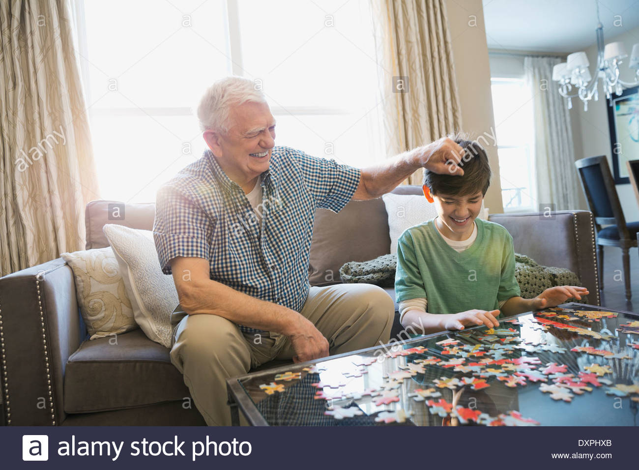 Child solving puzzle hi-res stock photography and images - Alamy