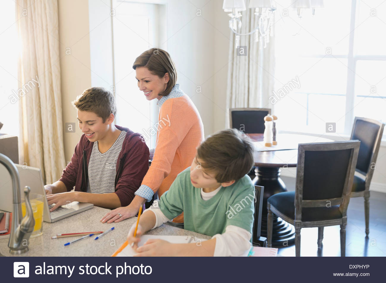 Mother assisting hi-res stock photography and images - Alamy