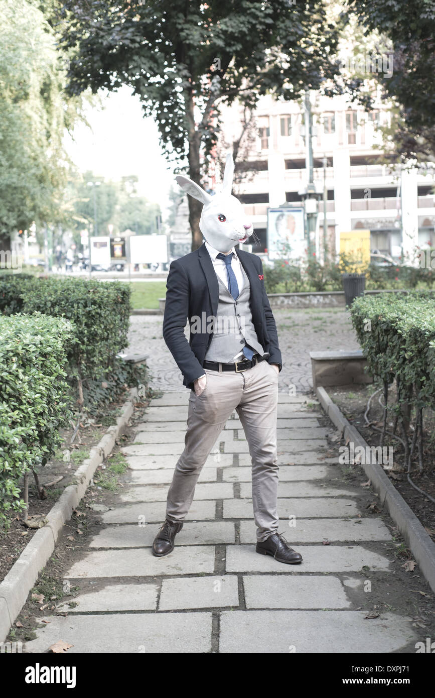 rabbit mask man sitting on sofa at home Stock Photo - Alamy