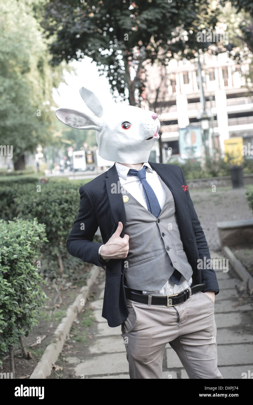 rabbit mask man sitting on sofa at home Stock Photo - Alamy