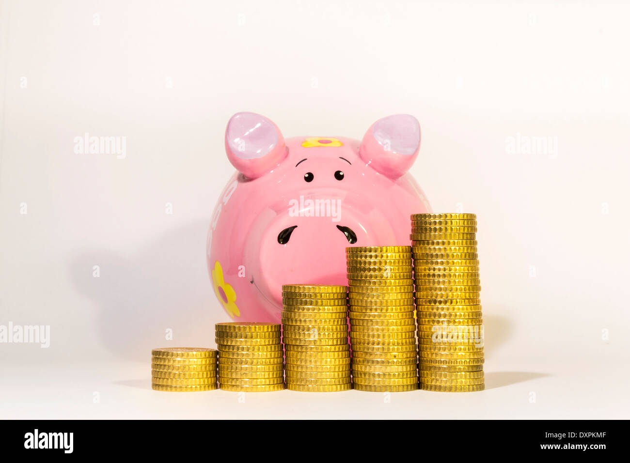 Yellow coins lined up from hi-res stock photography and images - Alamy