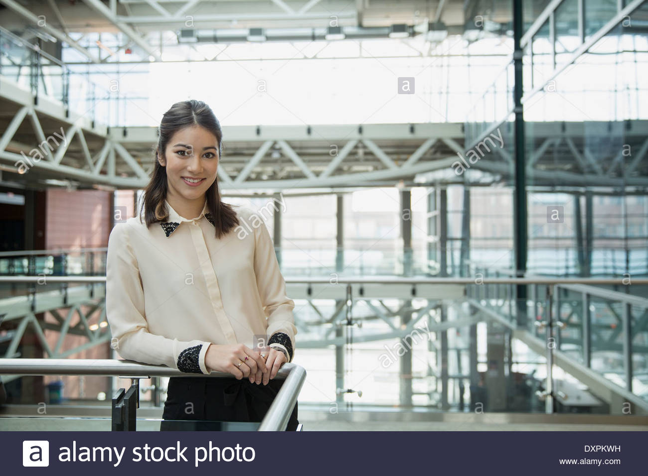 Woman leaning on railing looking at hi-res stock photography and images ...