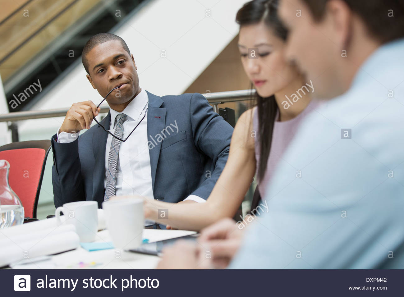 Serious business meeting suit table hi-res stock photography and images ...