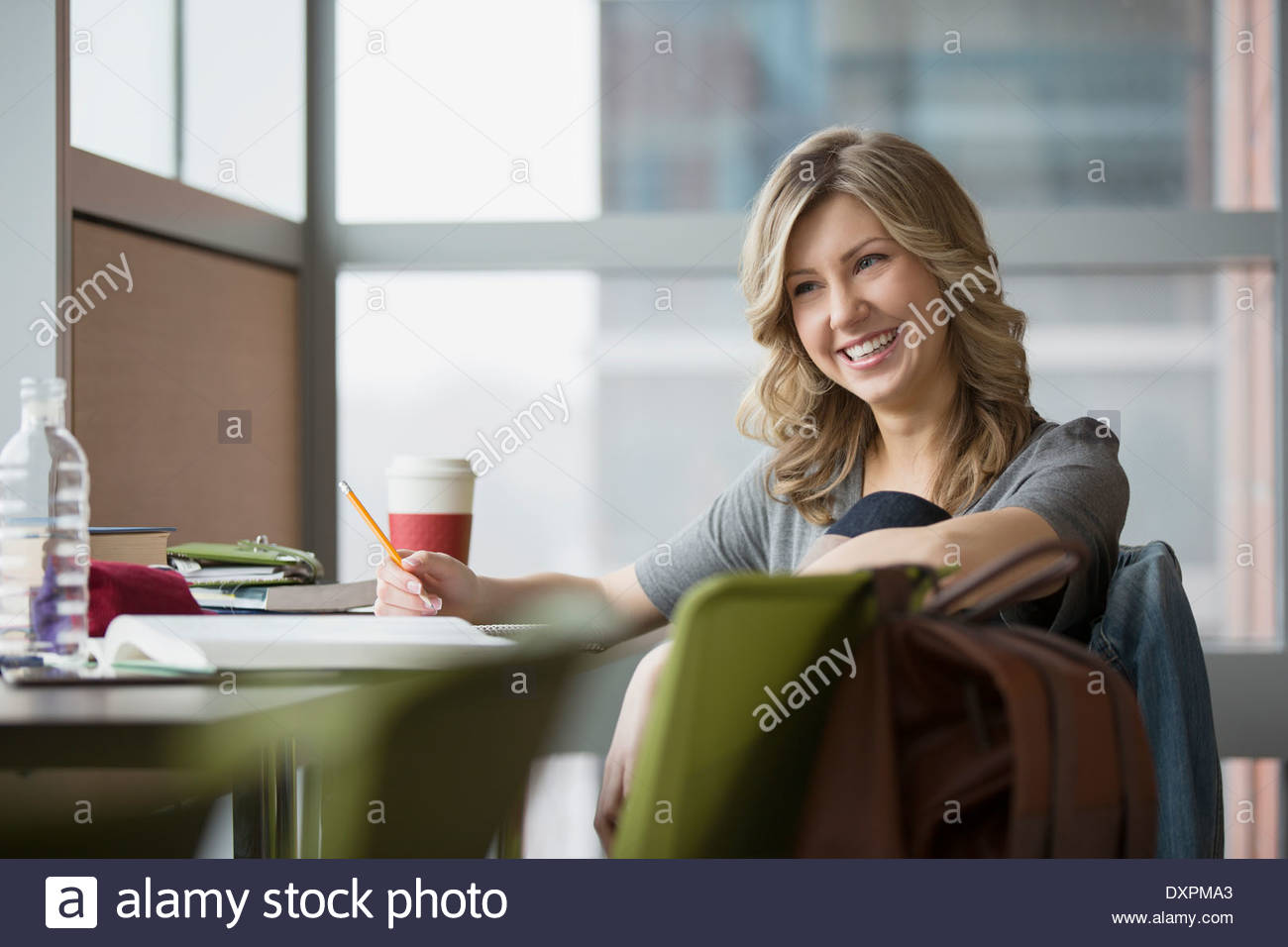 Student hugging knees classroom hi-res stock photography and images - Alamy
