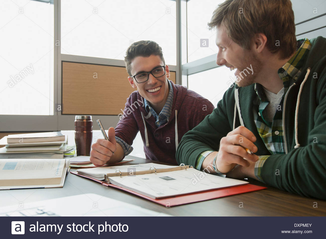 Students sitting table hi-res stock photography and images - Alamy