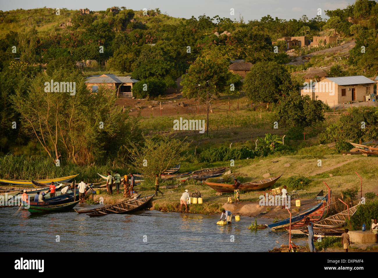 TANZANIA Mwanza, boats at Lake Victoria, people fetch water in jerry ...