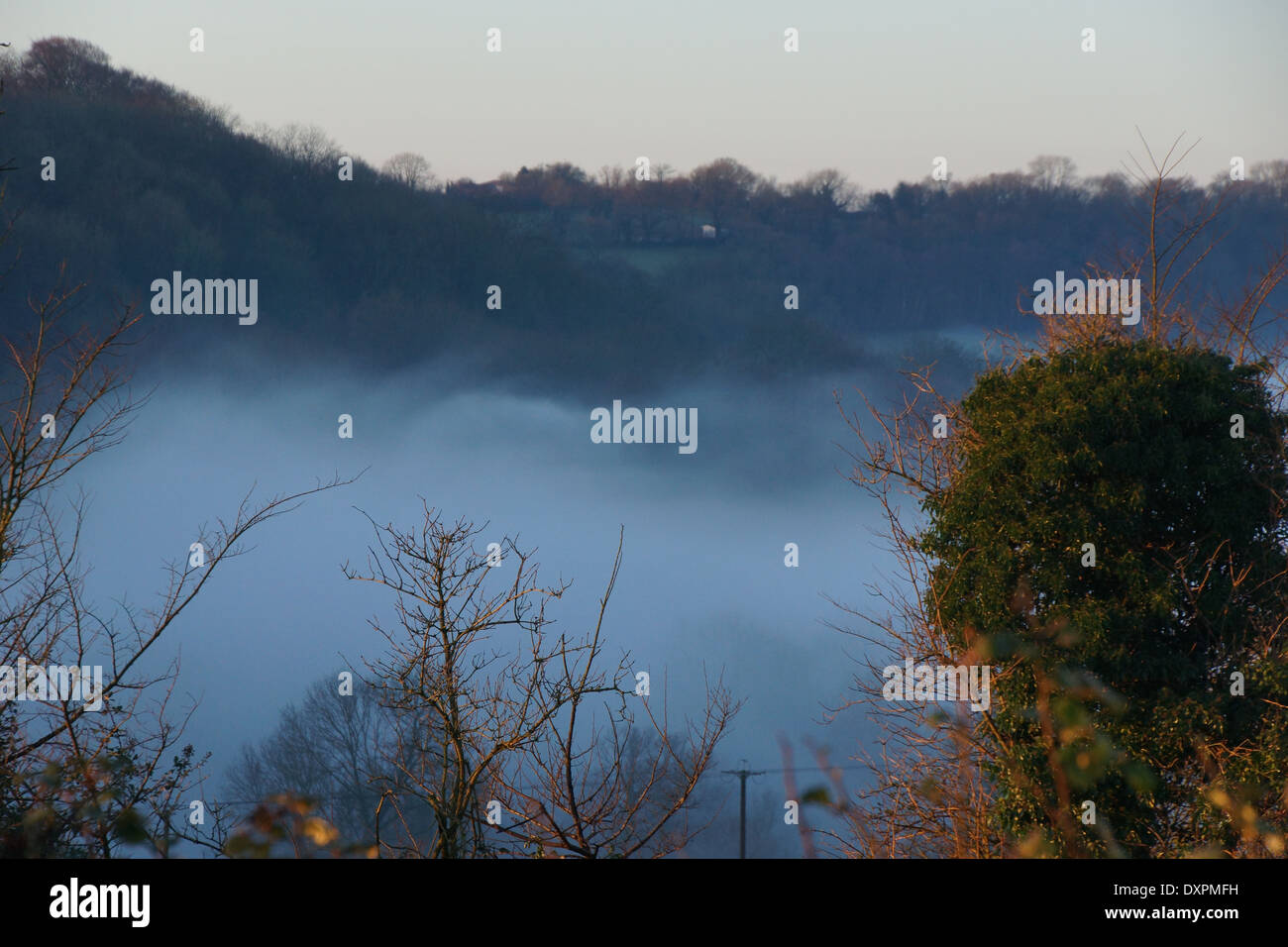 An atmospheric photograph of the mist in the valley Stock Photo - Alamy