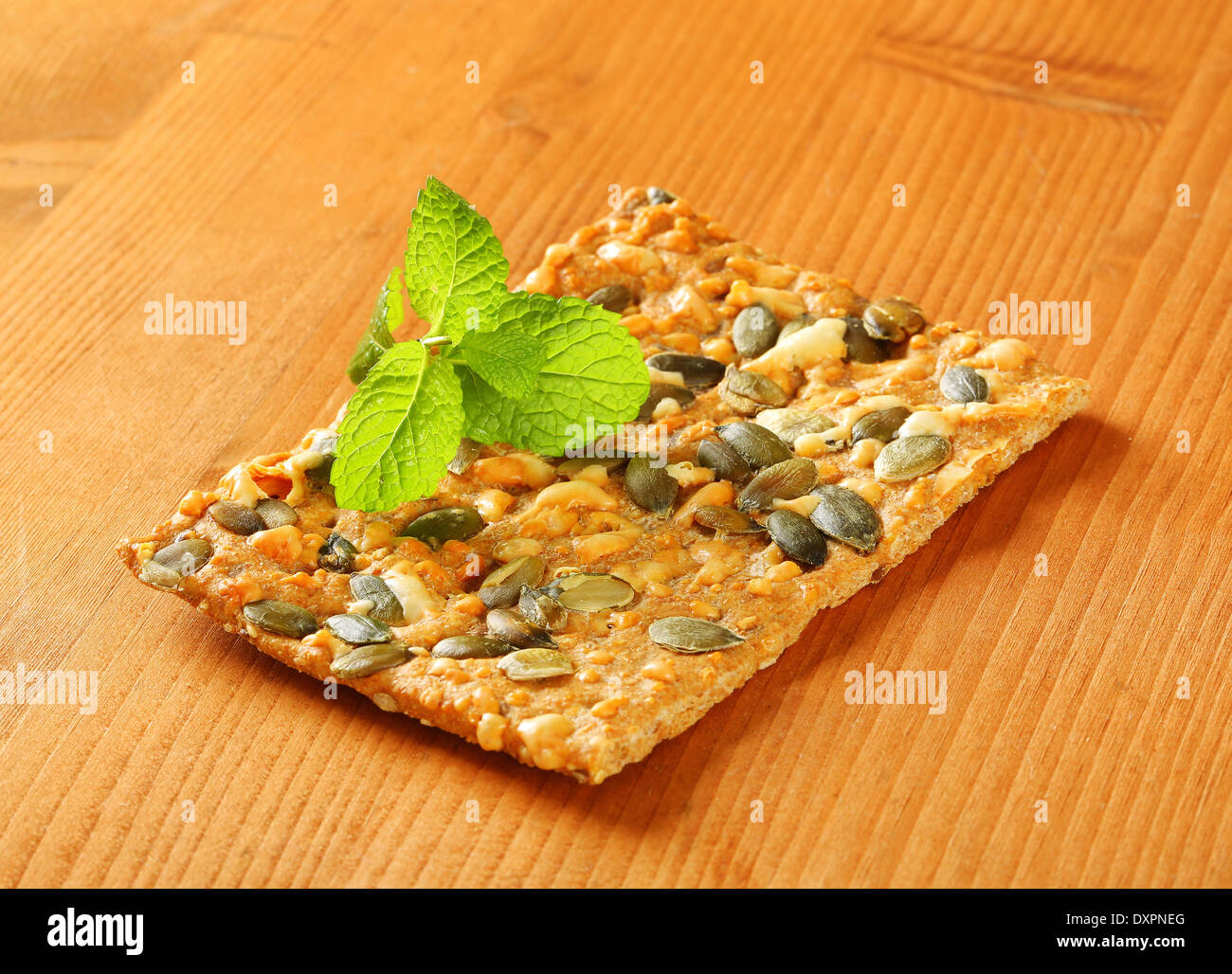 Whole grain cracker with cheddar and pepitas Stock Photo - Alamy