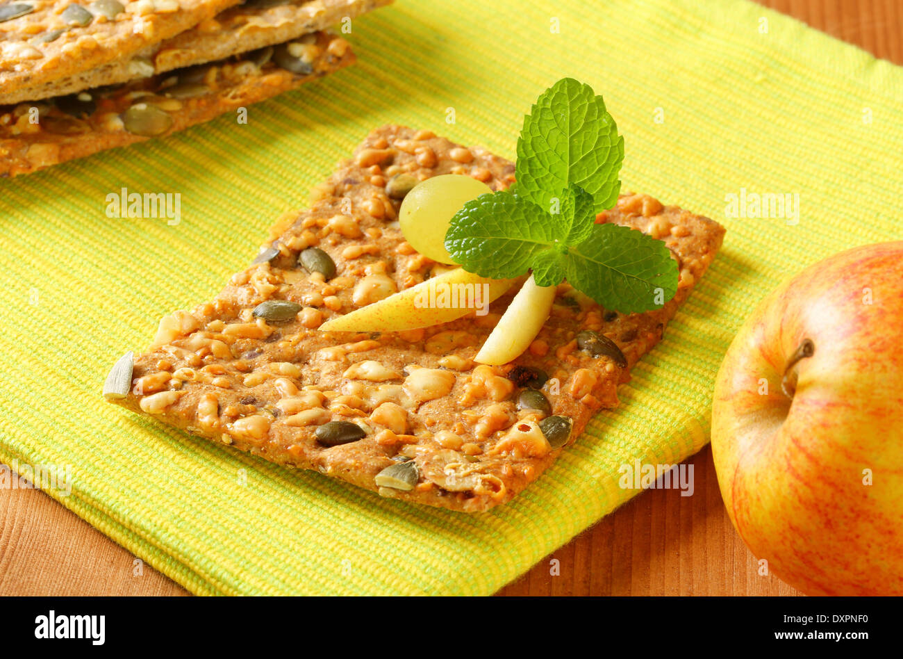 Whole grain cracker with cheddar and pepitas Stock Photo - Alamy