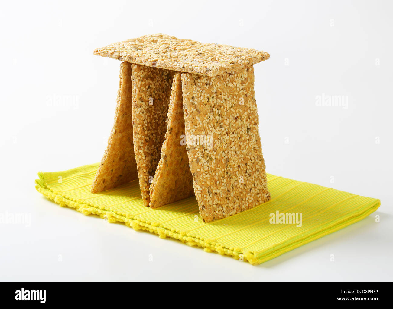 Whole wheat crackers with sesame seeds and chopped herbs Stock Photo ...
