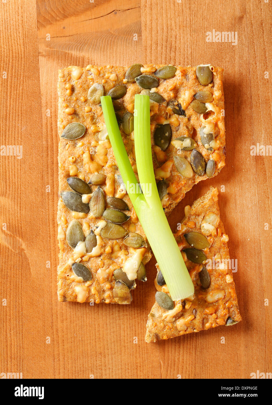Whole grain cracker with cheddar and pepitas Stock Photo - Alamy