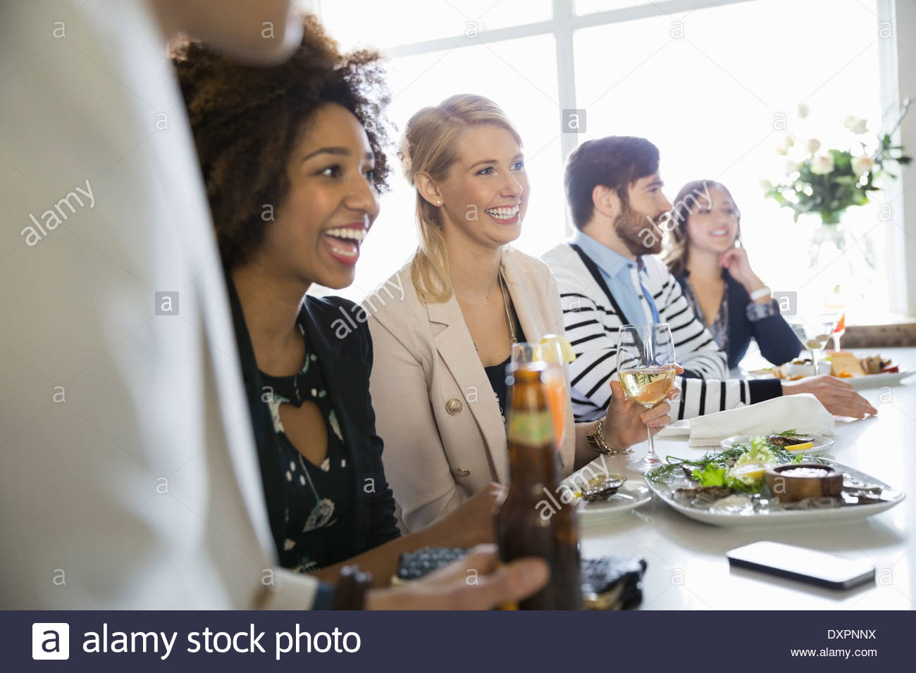 Young people drinking alcohol eating hi-res stock photography and ...