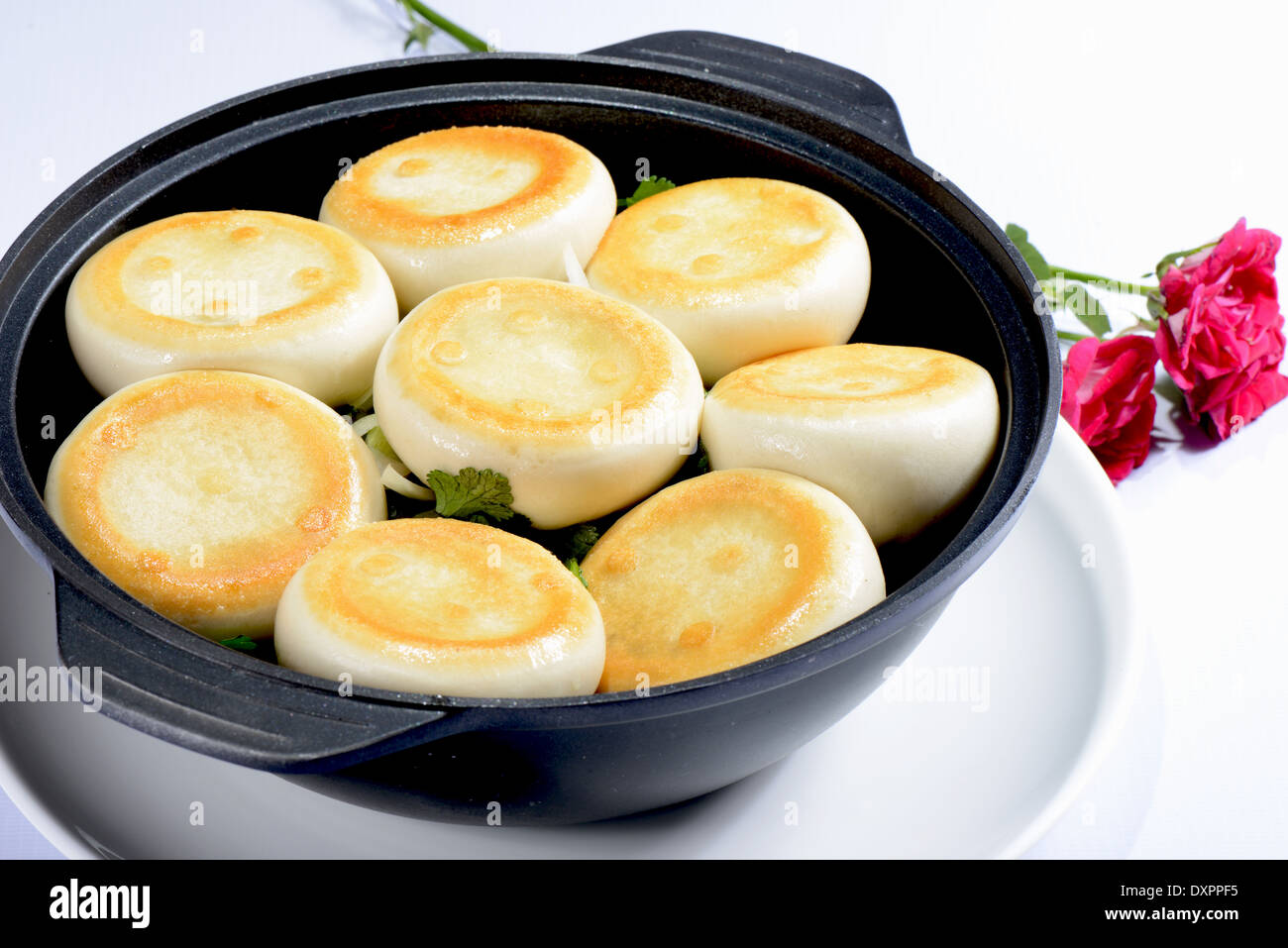 Chinese Food:Toasted Dumplings in a black pot decorated with roses ...