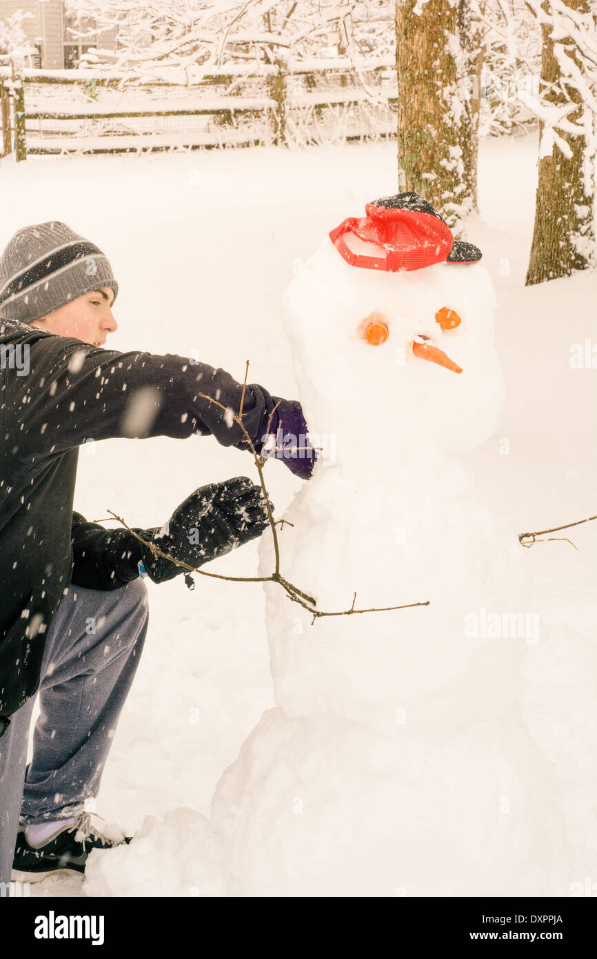 Building a Snowman Stock Photo - Alamy