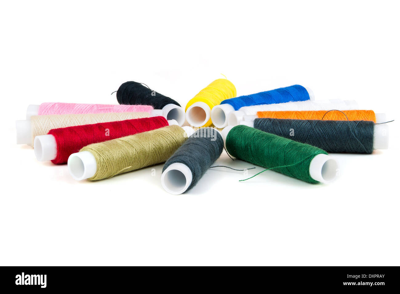 Colored spools of threads isolated on white background Stock Photo - Alamy