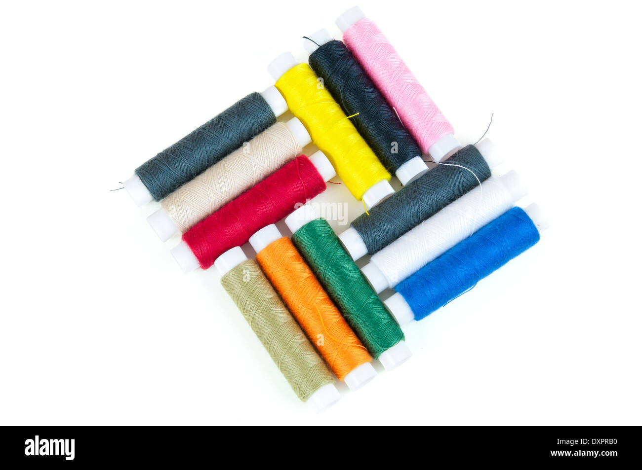 Colored spools of threads isolated on white background Stock Photo - Alamy