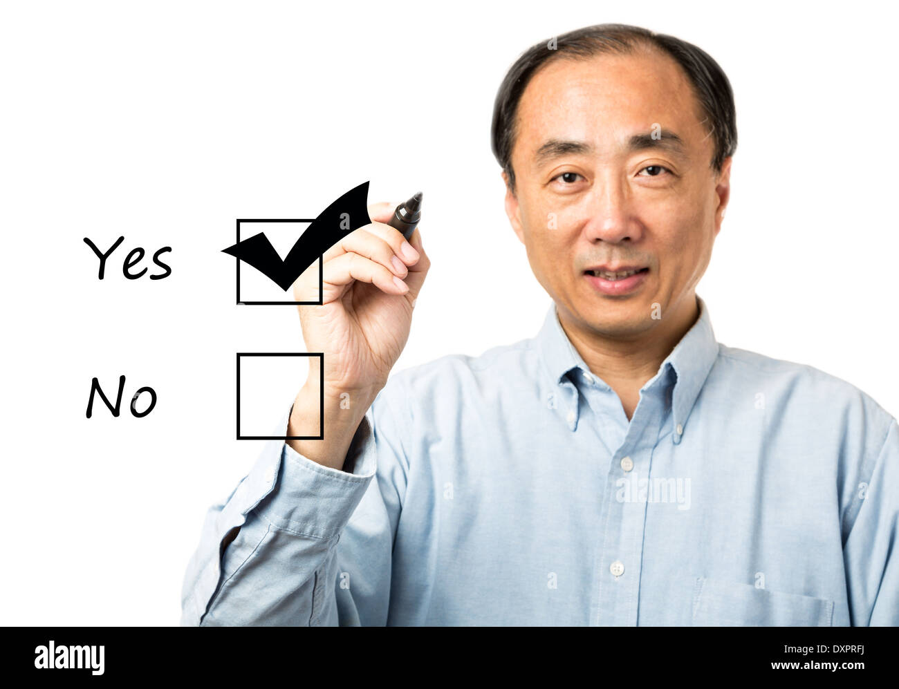 Asian man checks YES on yes or no check list Stock Photo - Alamy
