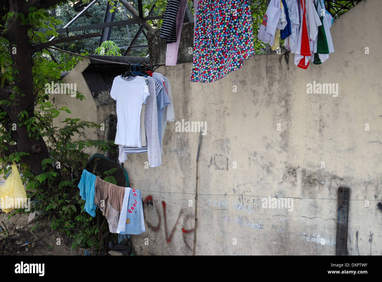Washing hanging outside squatter camp, Manila, Philippines Stock Photo ...