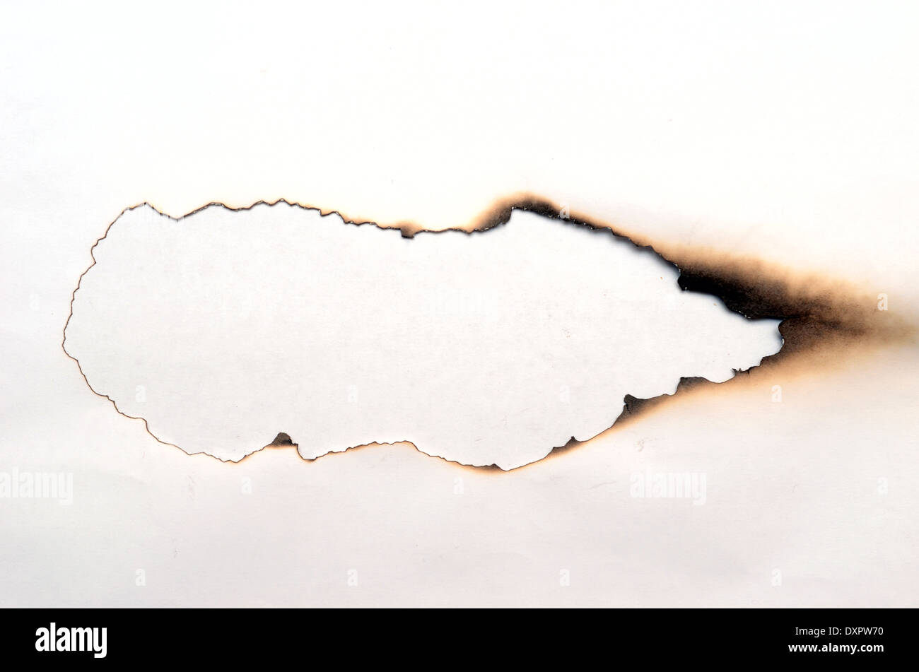 burnt hole in a paper Stock Photo - Alamy