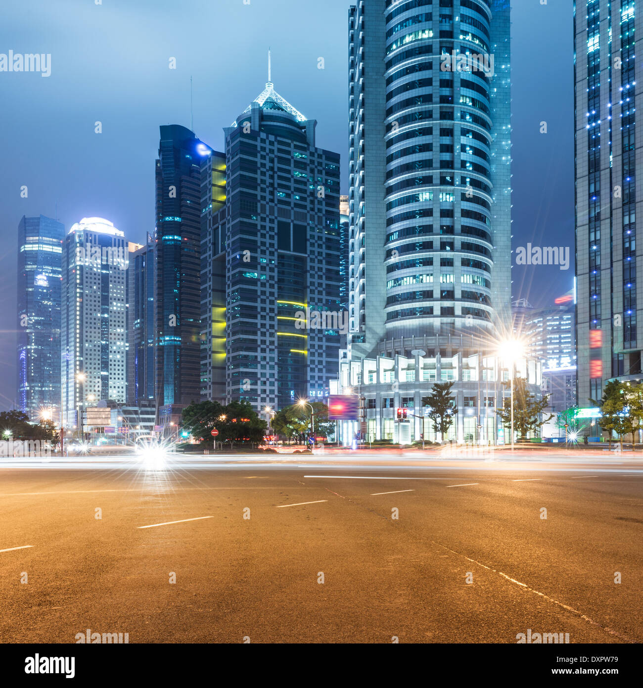 the light trails on the modern building background in shanghai china ...