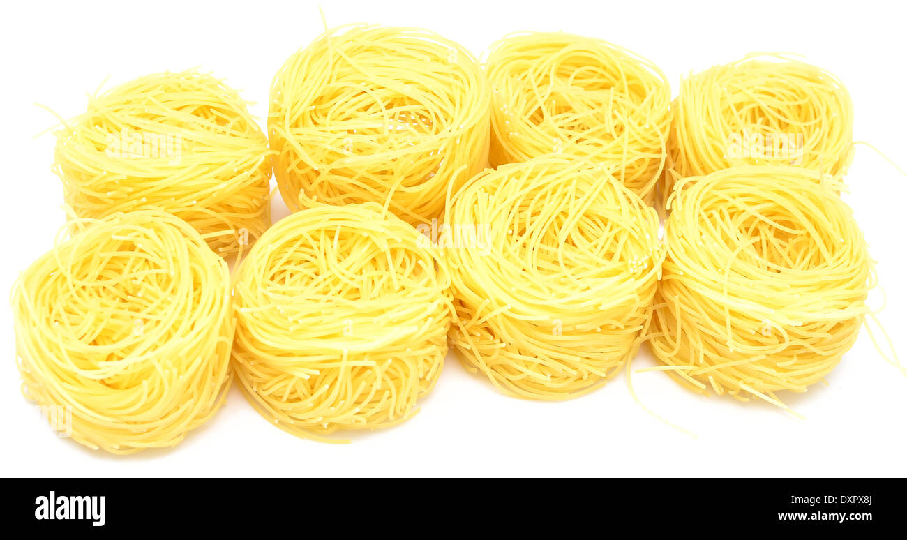 raw round pasta isolated on white background Stock Photo - Alamy