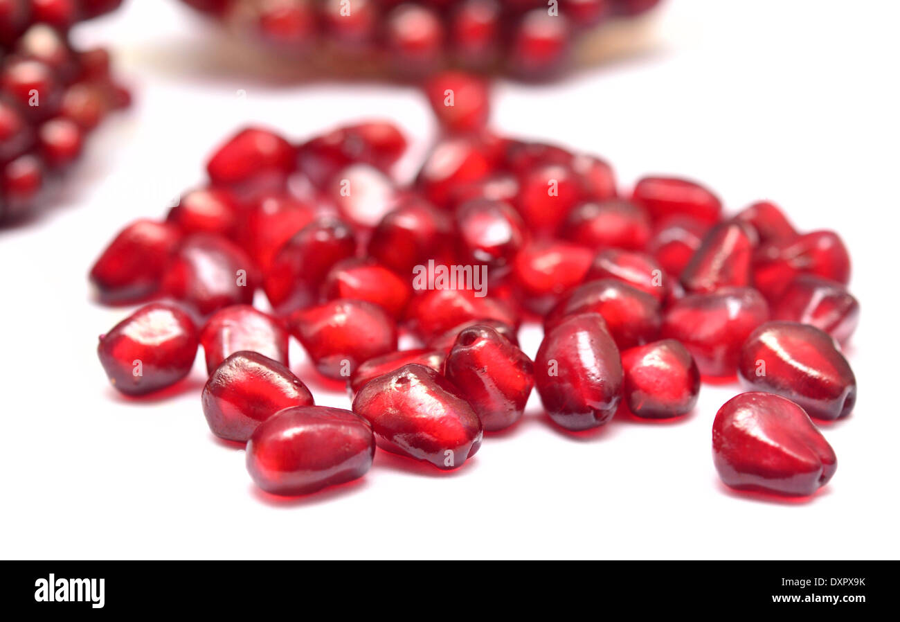 pomegranate seeds on white Stock Photo - Alamy