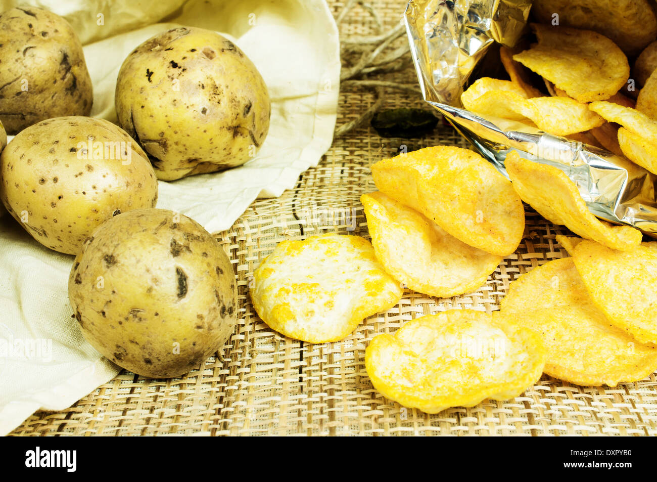 Natural potato chips in a package and potatoes in the bag Stock Photo ...