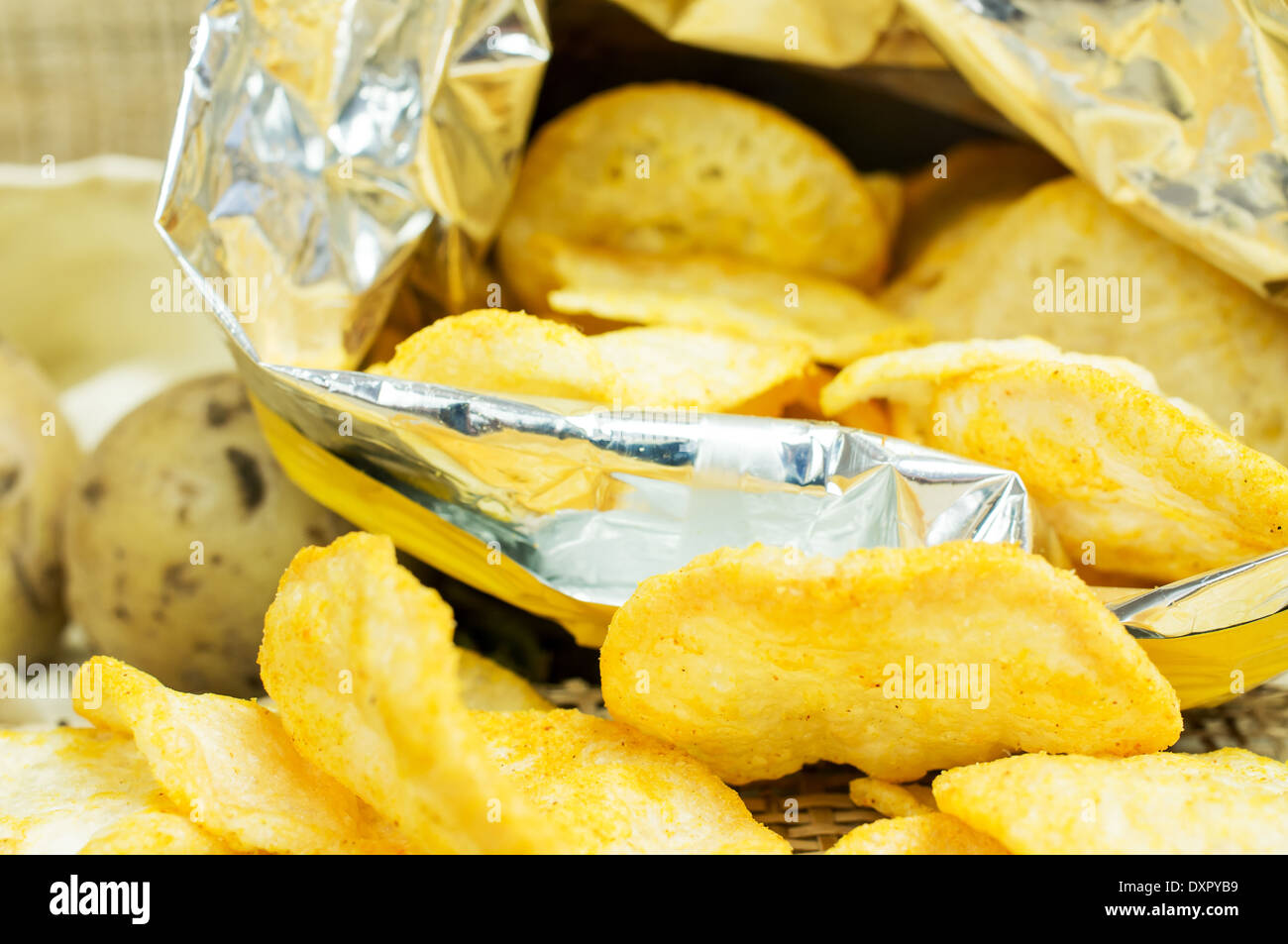 Natural potato chips in a package and potatoes in the bag Stock Photo ...