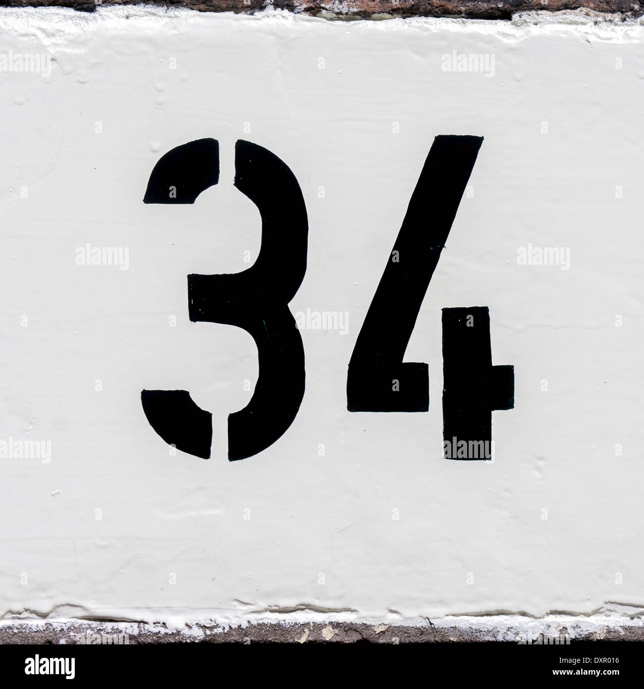 house number thirty four. Black template lettering on white background ...