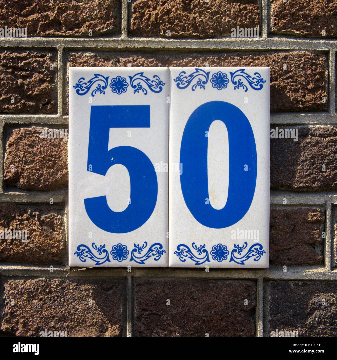 house number fifty consisting of two separate tiles. Blue lettering on ...