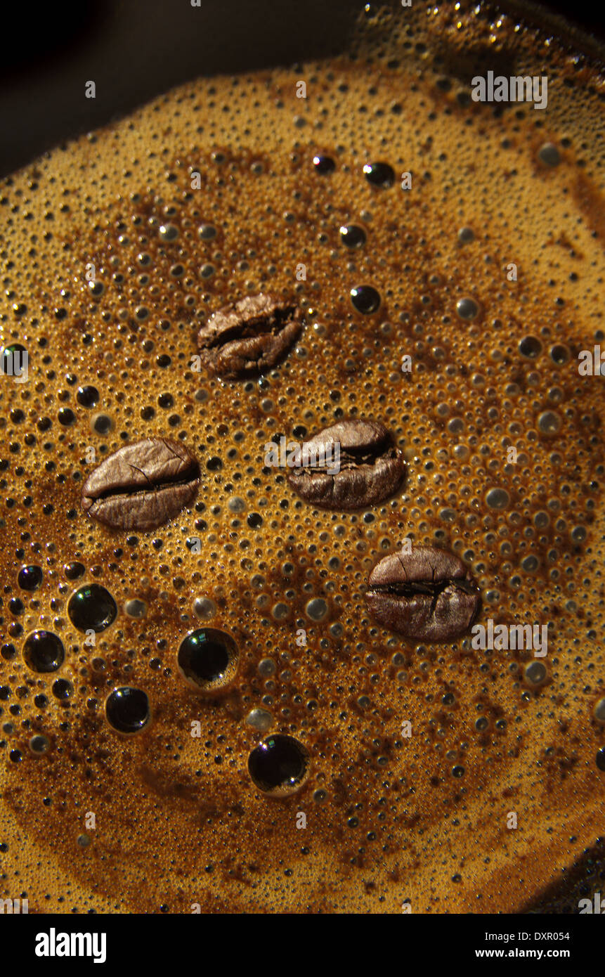 Coffee beans on the top of coffe foam Stock Photo - Alamy