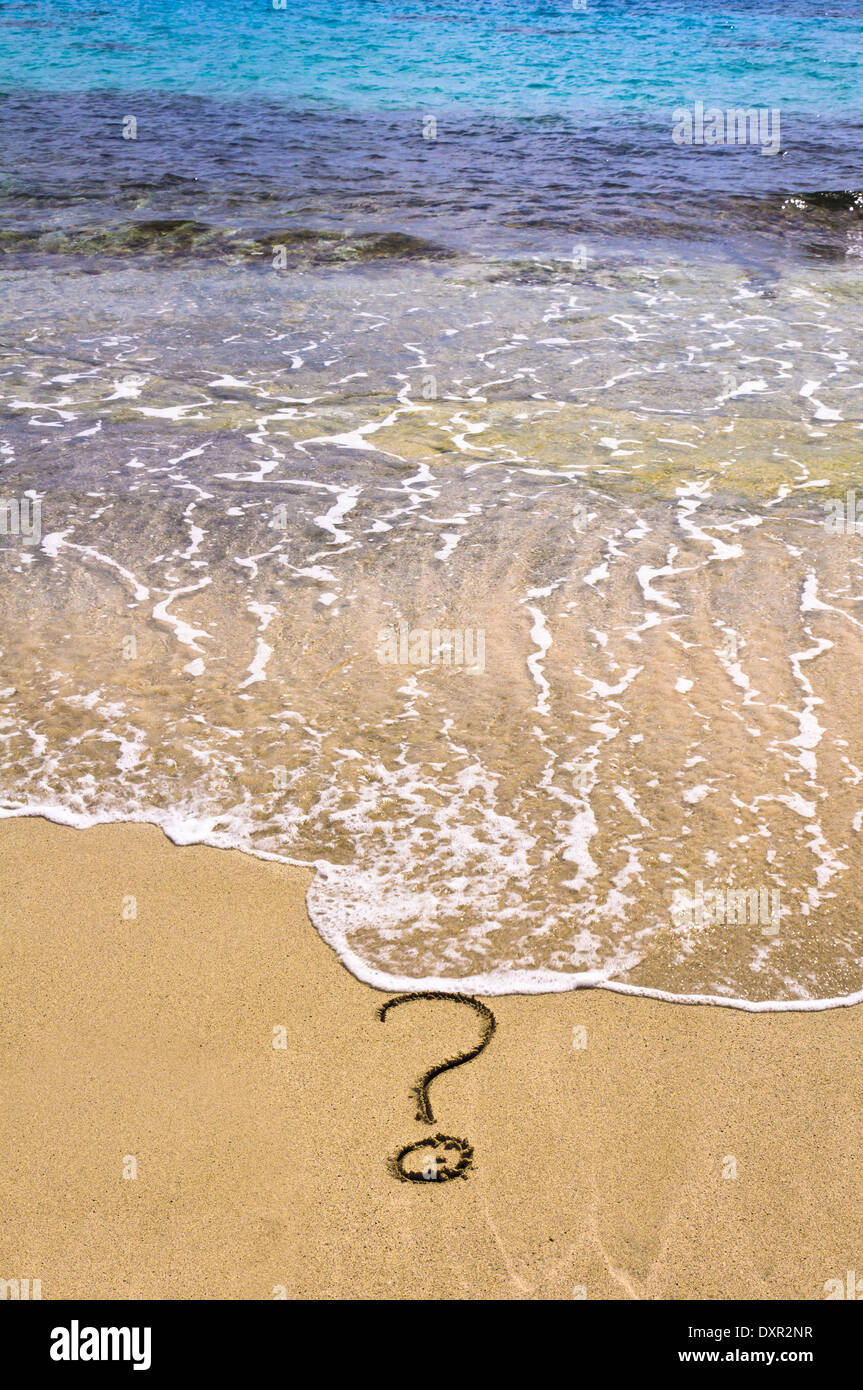 question mark sign in sand beach, sea water and clear blue sky Stock ...