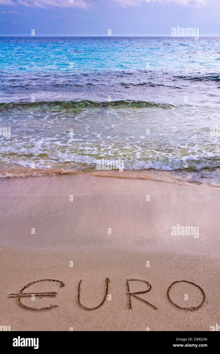 euro word written in the sand on a beach Stock Photo - Alamy