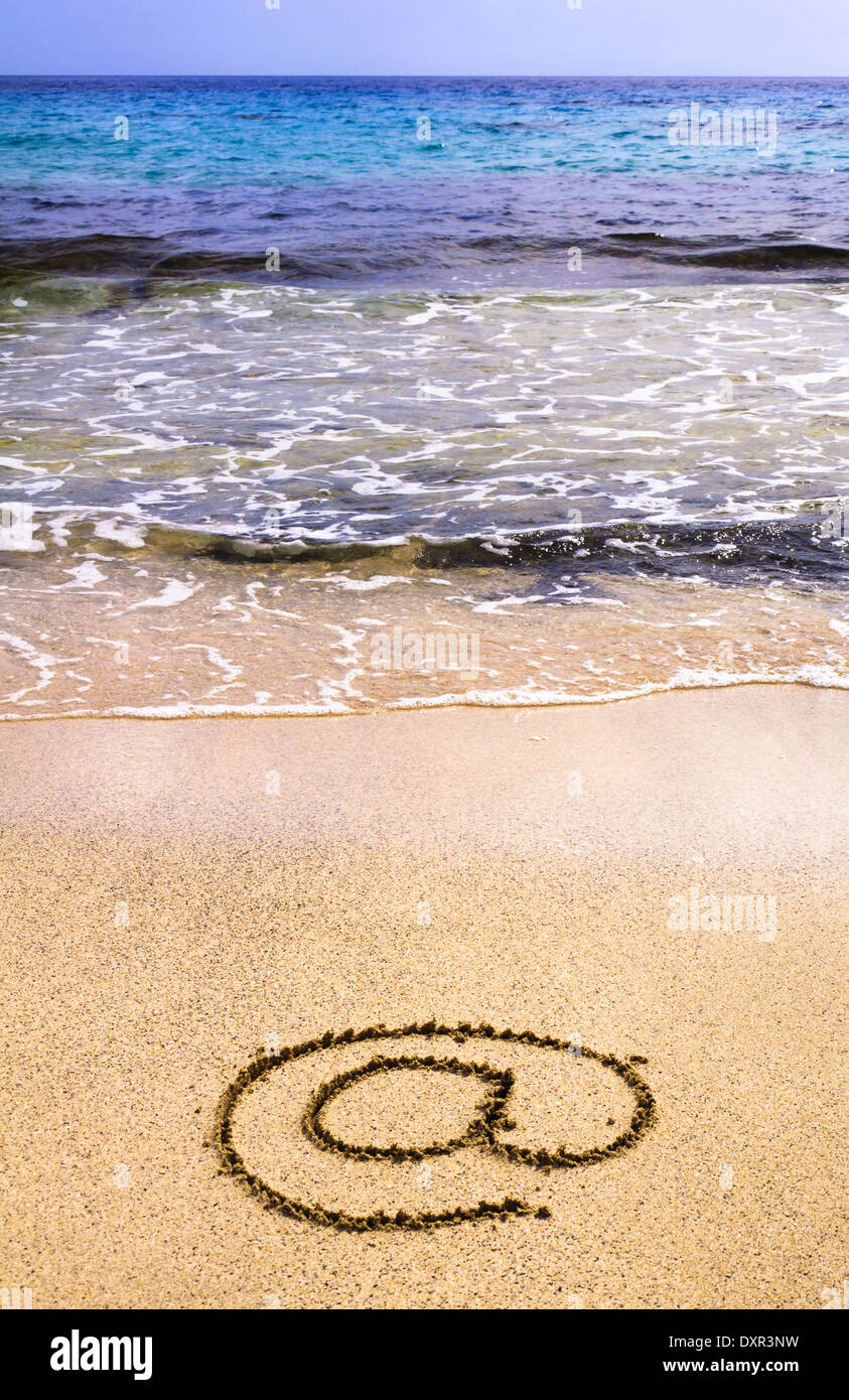 At sign drawn in the sand Stock Photo - Alamy