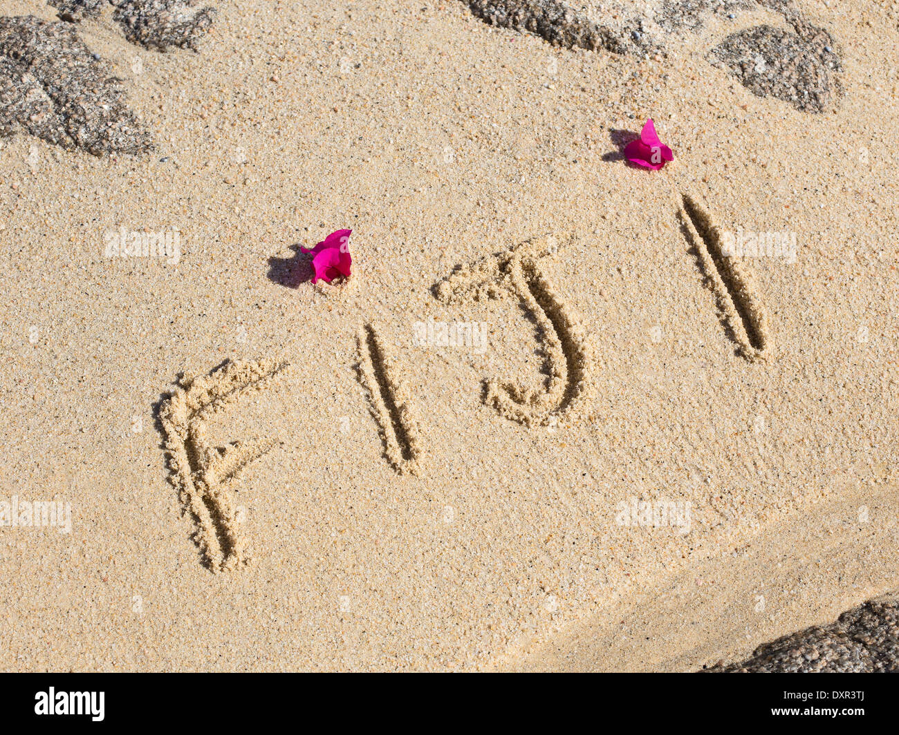 fiji islands written on the sand Stock Photo - Alamy