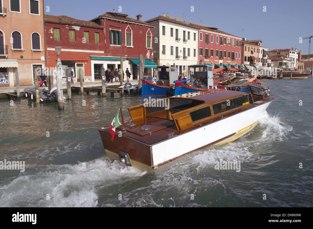 Buildings and boats along the channel in Murano island in Venice Stock ...