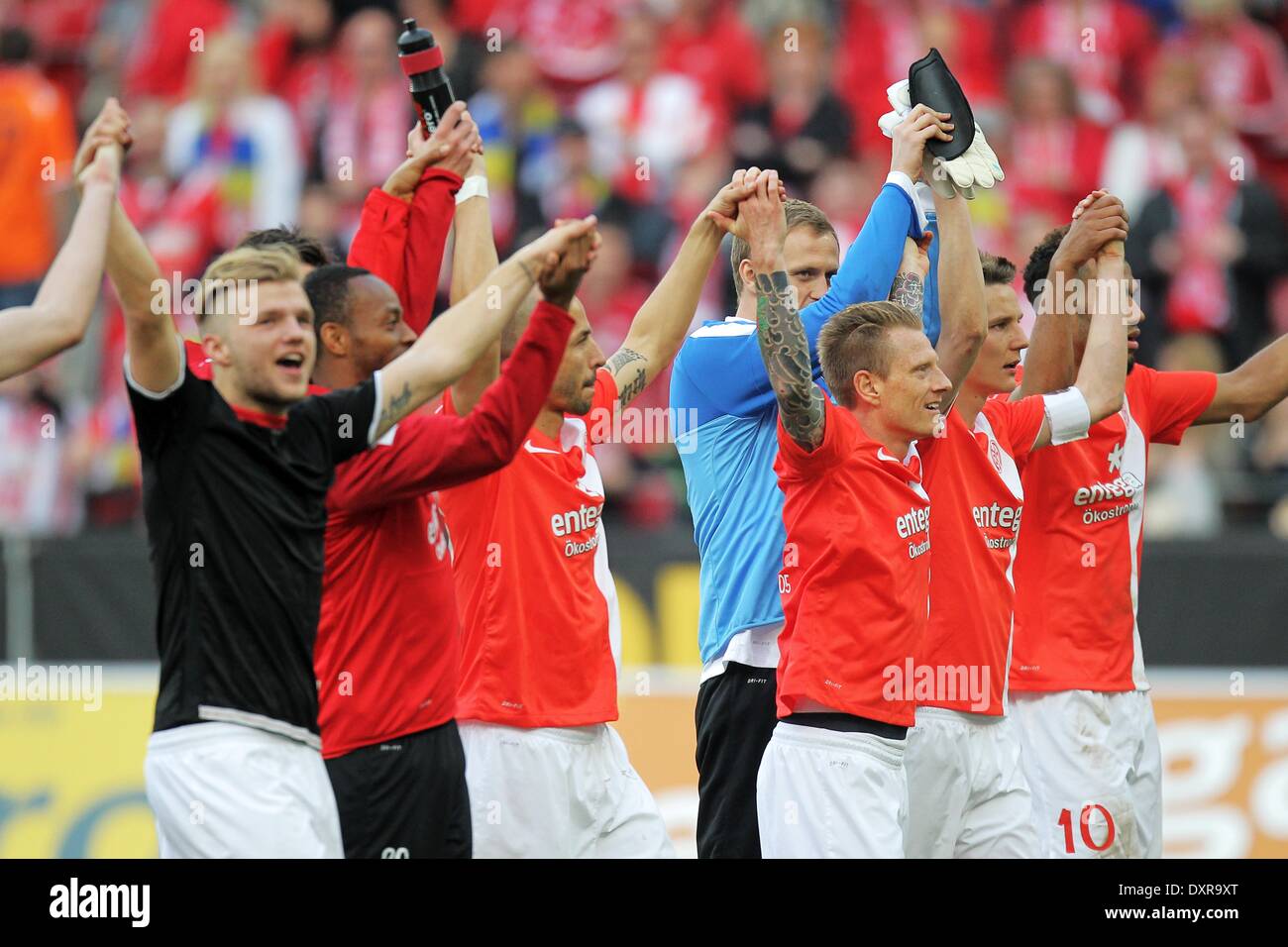 Mainz, Germany. 29th Mar, 2014. Mainz's players celebrate after the ...