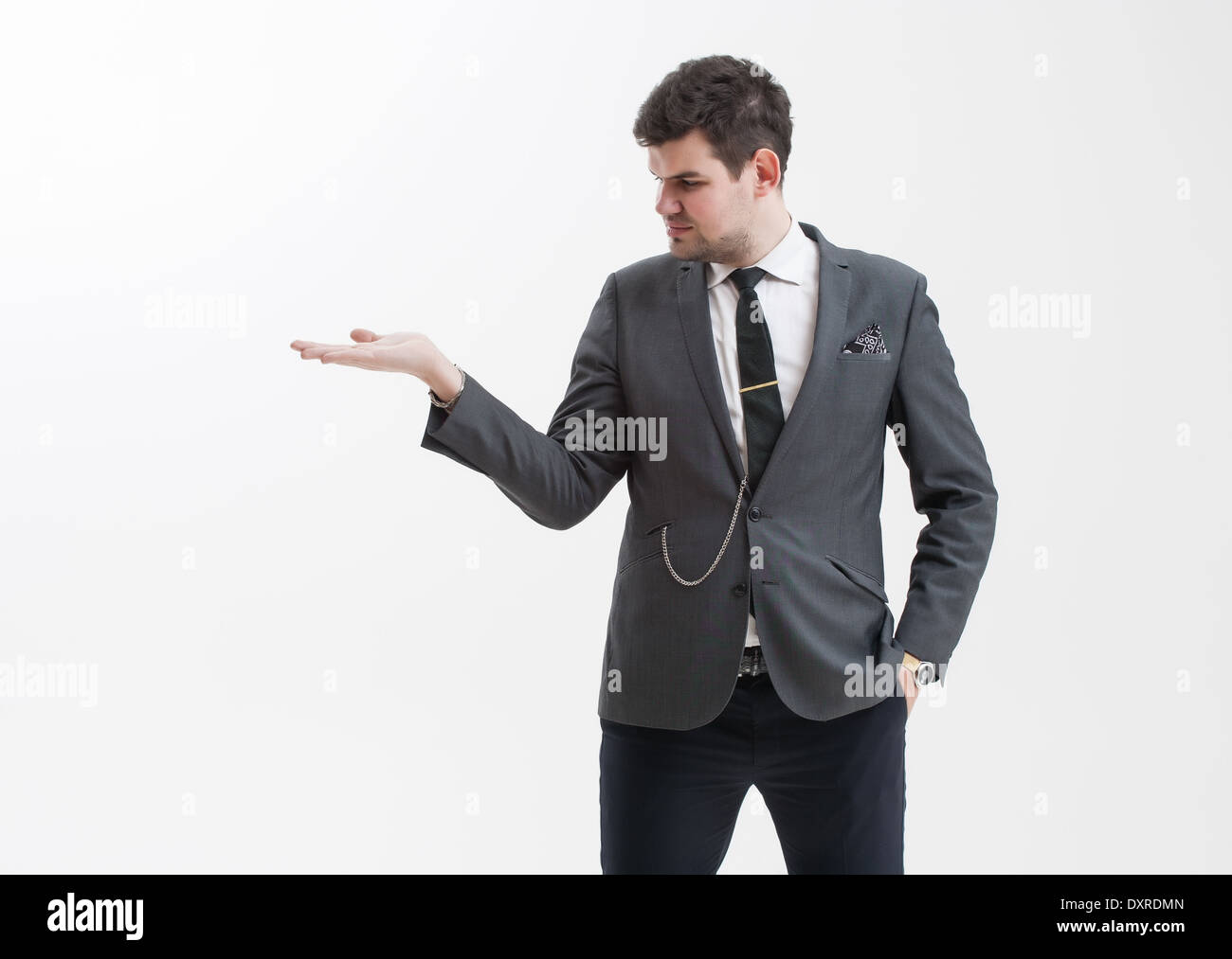 Handsome man makes a gesture with his hand. Beautiful gray suit Stock ...