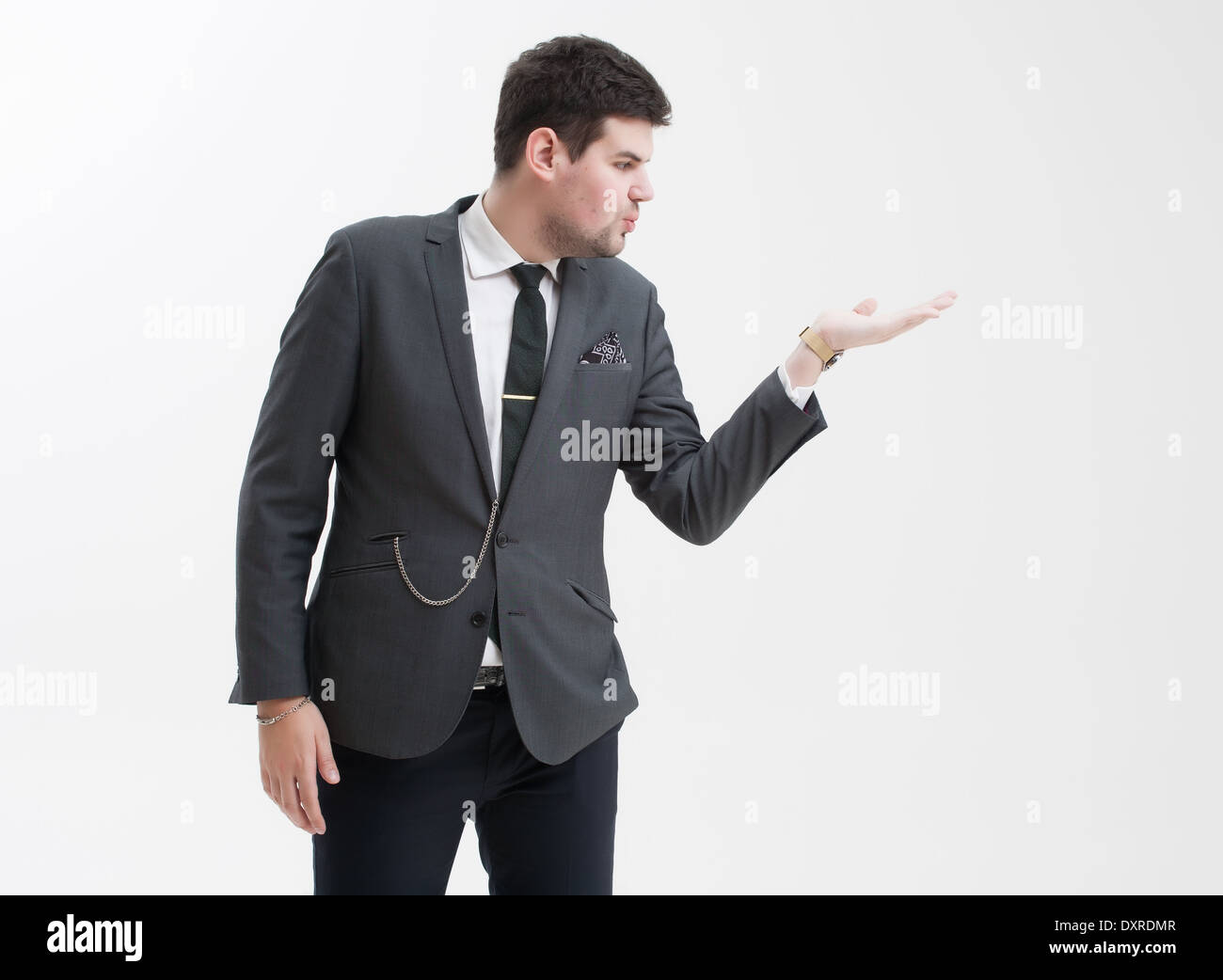 Handsome man makes a gesture with his hand. Beautiful gray suit Stock ...