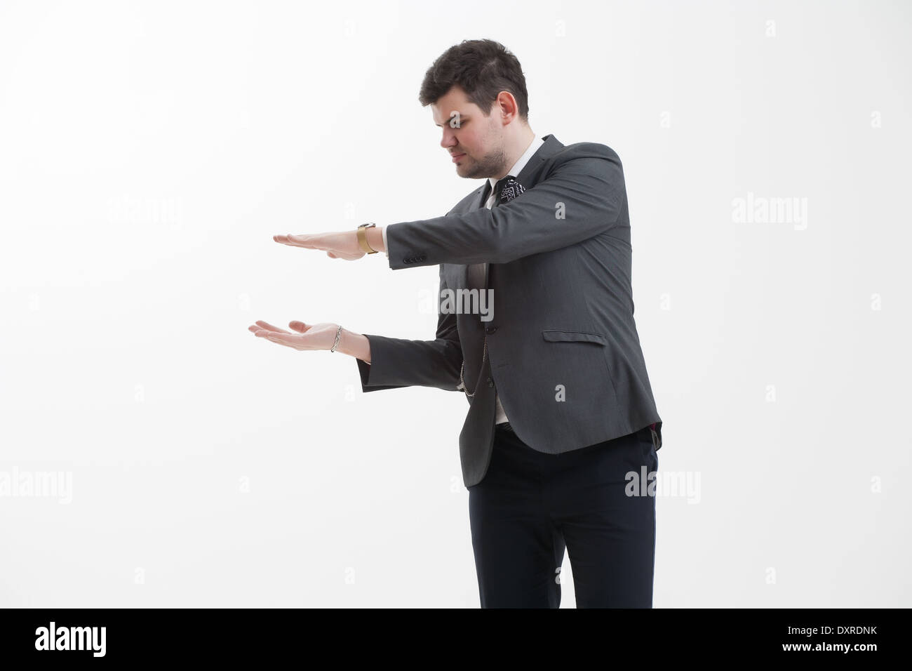 Handsome man makes a gesture with his hand. Beautiful gray suit Stock ...