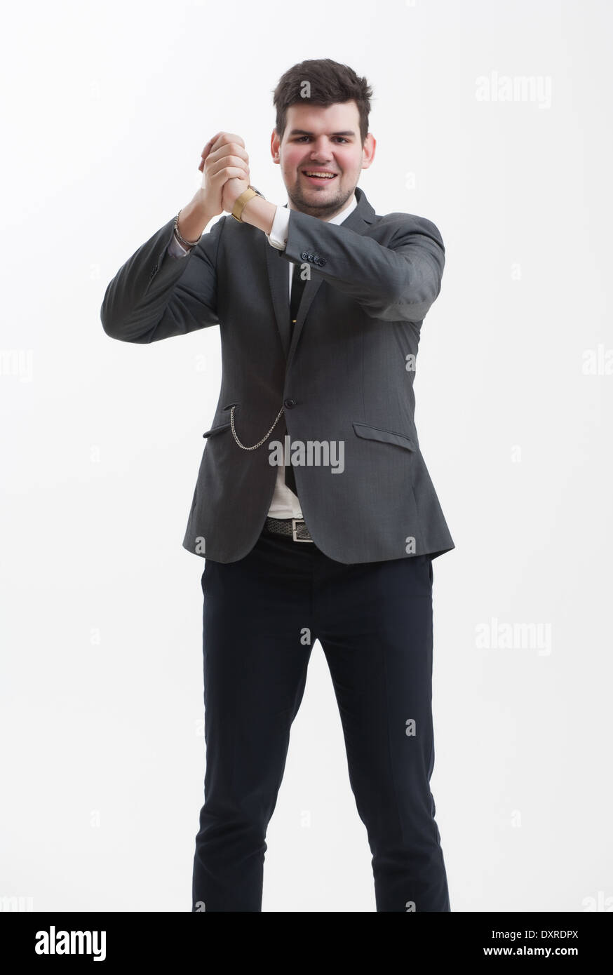 Handsome Businessman in a nice suit showing signs by his hands. Tall ...