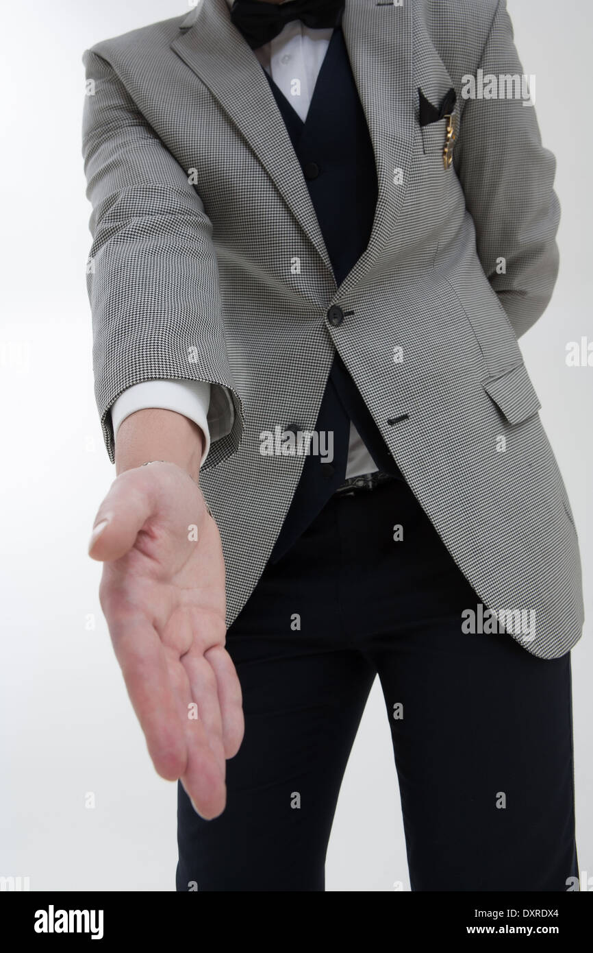 A man gives a helping hand. Hand with golden watch on wrist. Euro sign ...
