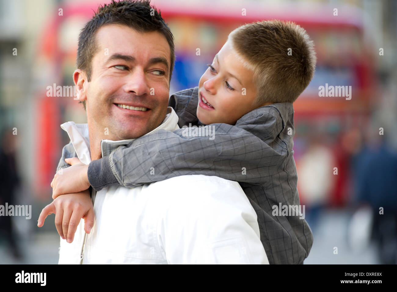 Father holding son walking in London street Stock Photo - Alamy