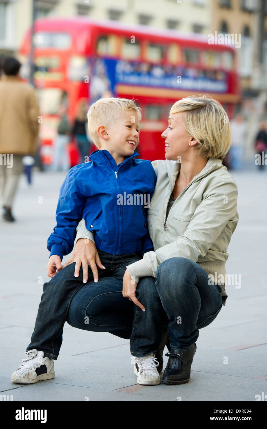 Mother and son in London street Stock Photo - Alamy