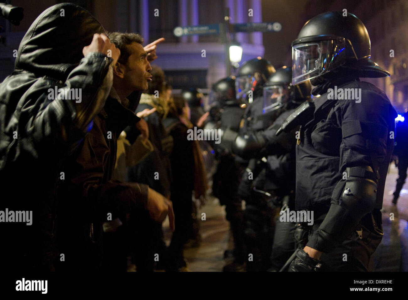 Barcelona, Spain -29th March, 2014. Protesters facing riot police in ...