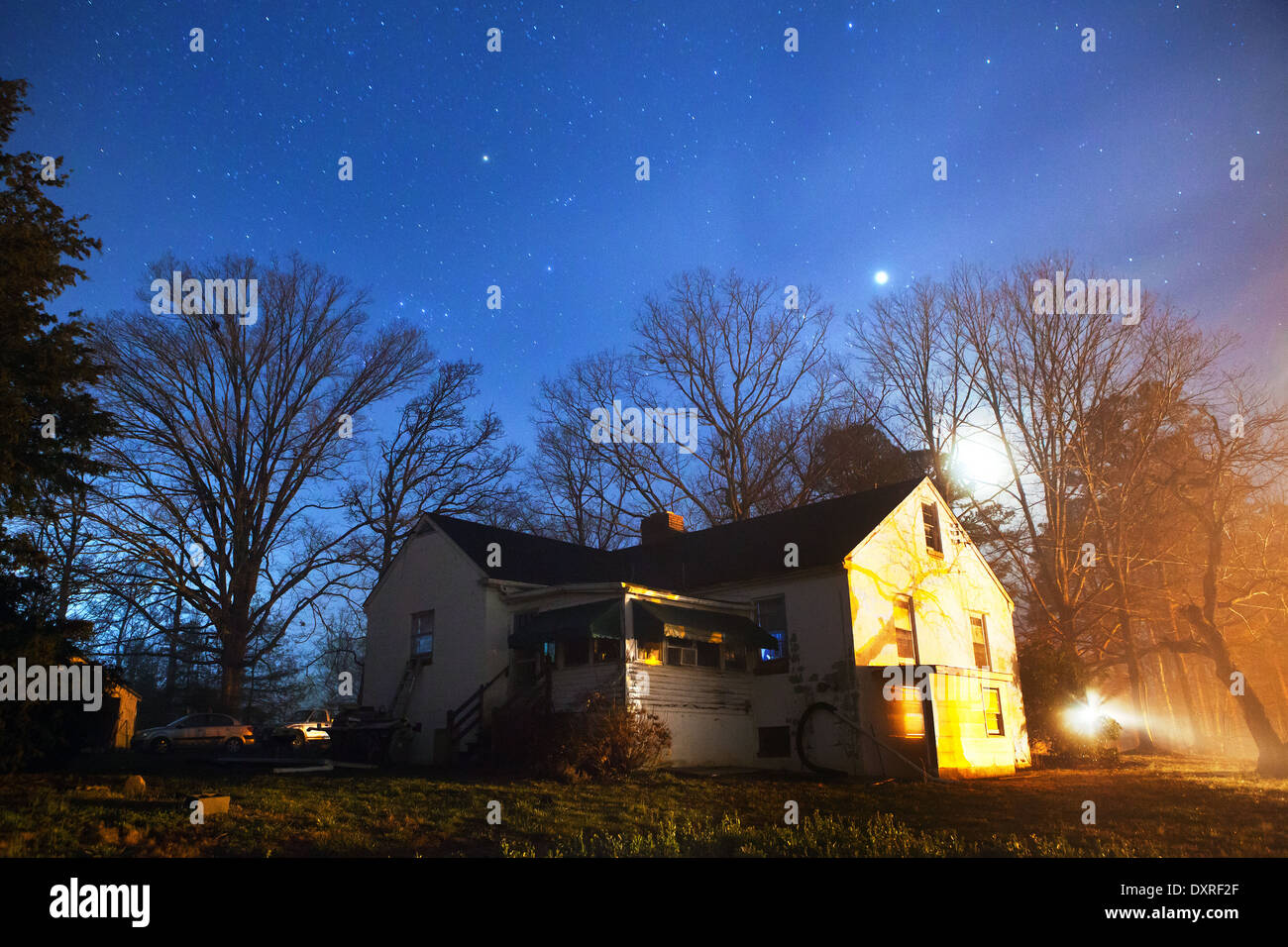House set in eery nighttime landscape in countryside Stock Photo - Alamy