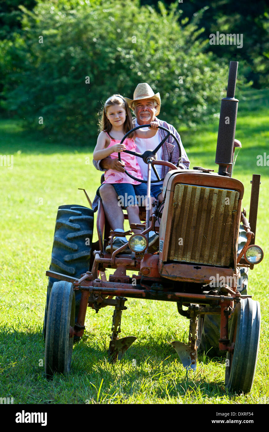 Girl driving tractor hi-res stock photography and images - Alamy
