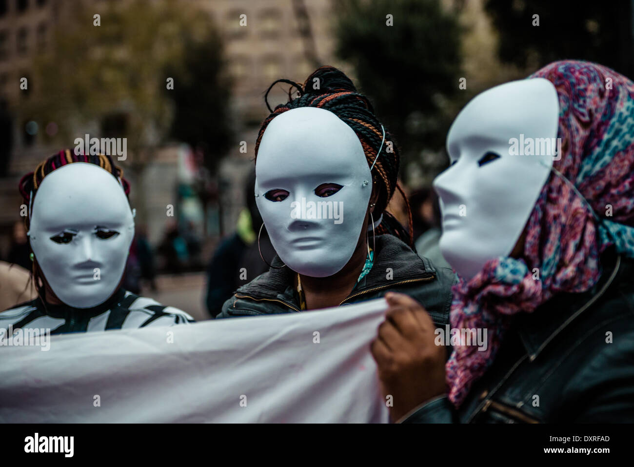 Barcelona, Spain. March 29th, 2014: Demonstrators wearing white masks ...