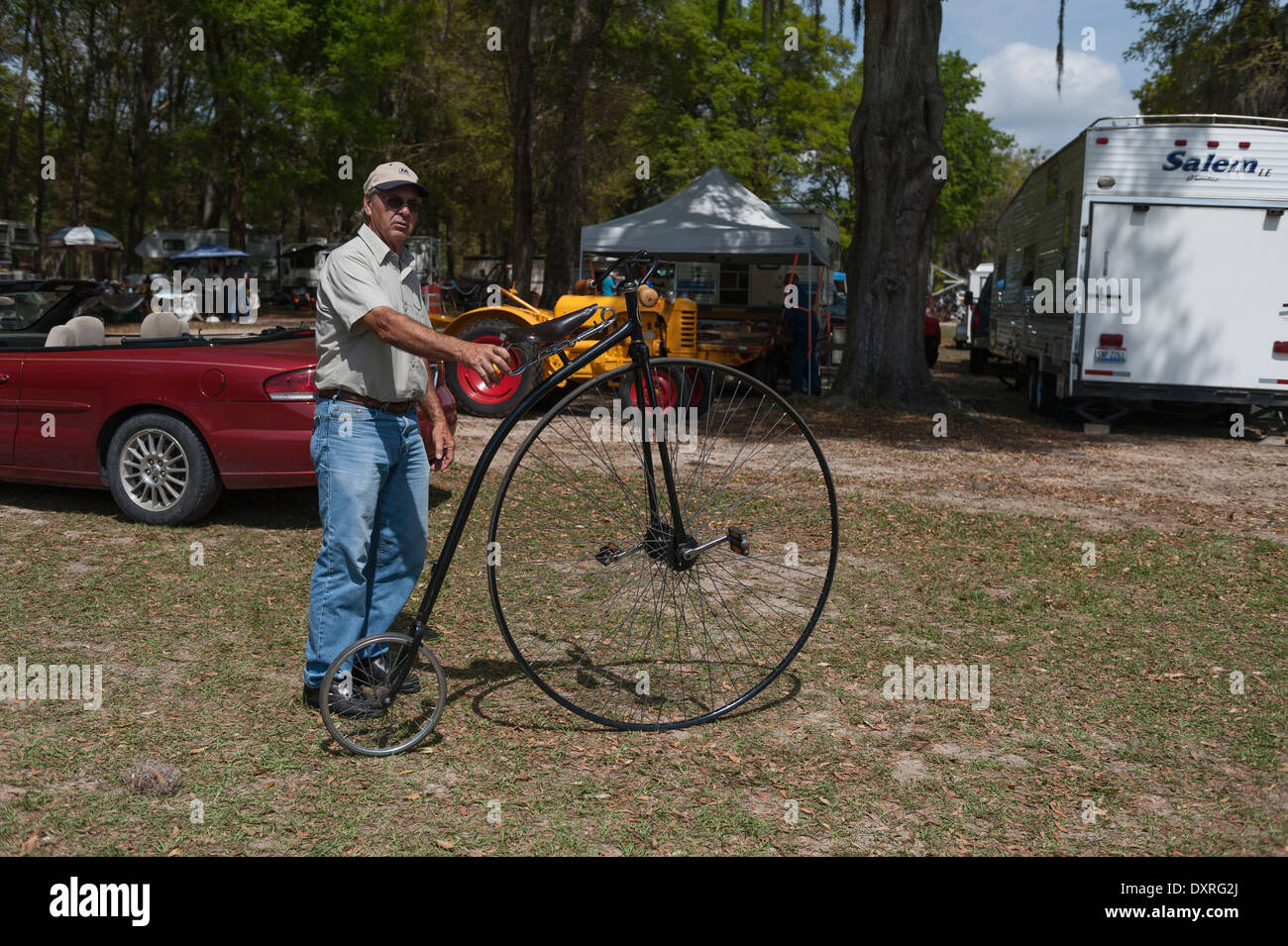 Man holding a Vintage Antique Big Wheel Bicycle Stock Photo - Alamy